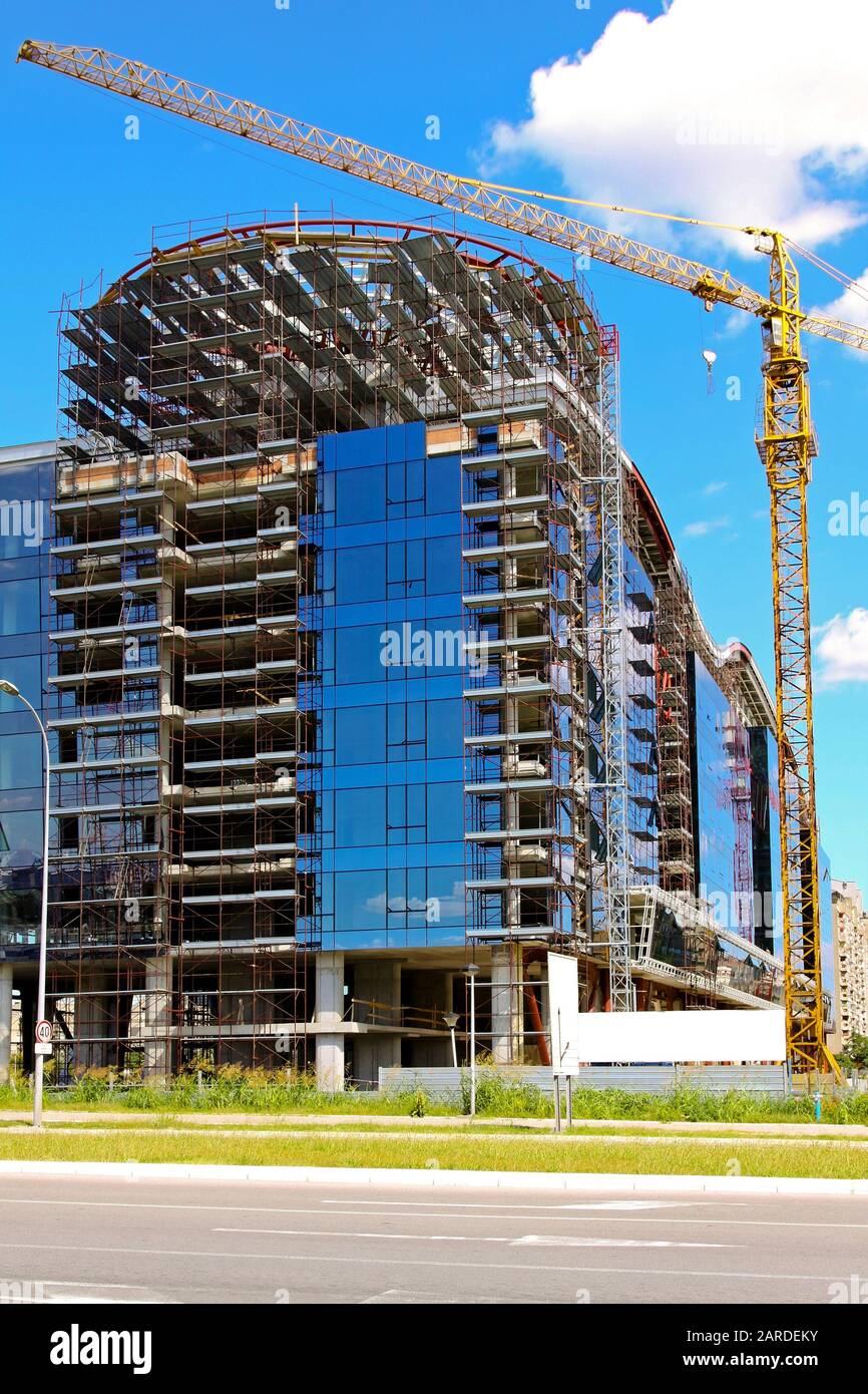 Commercial building with blue windows under construction Stock Photo ...