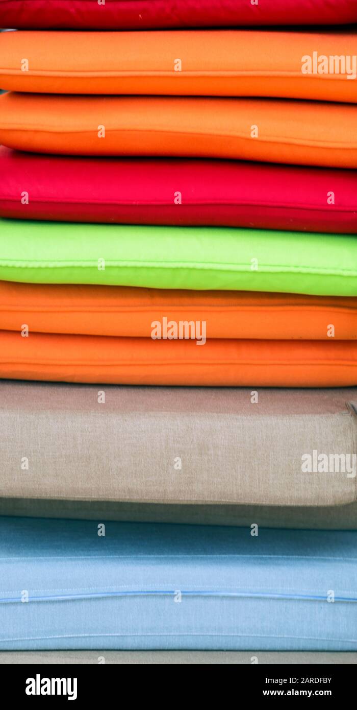 pile of colorful decorative chair pillows Stock Photo - Alamy