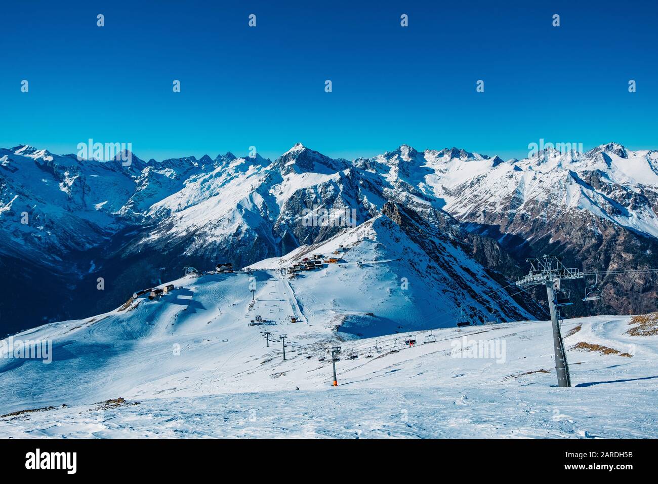 Downhill skiing resort in high mountains. Ski slope and ropeway lift ...