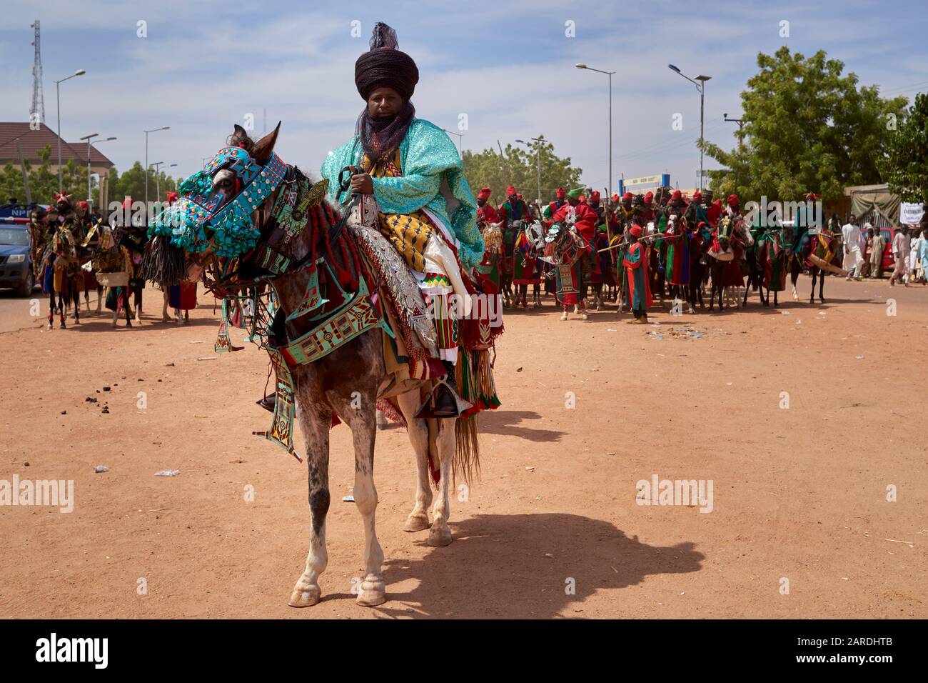 Nobleman rider dressed in a colourful outfit mounting an embellished ...
