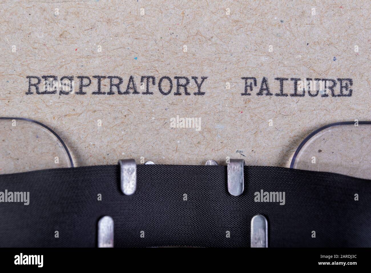 The word respiratory failure written in typewriter font. The ...