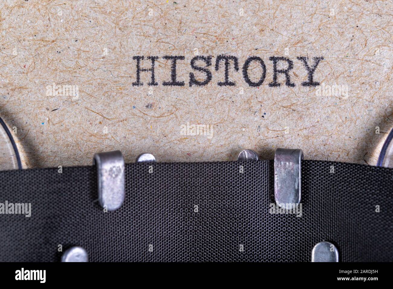 The word history written in typewriter font. The inscription in the old ...