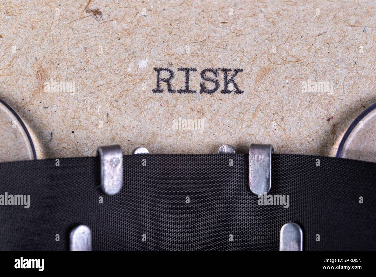 The word risk written in typewriter font. The inscription in the old ...