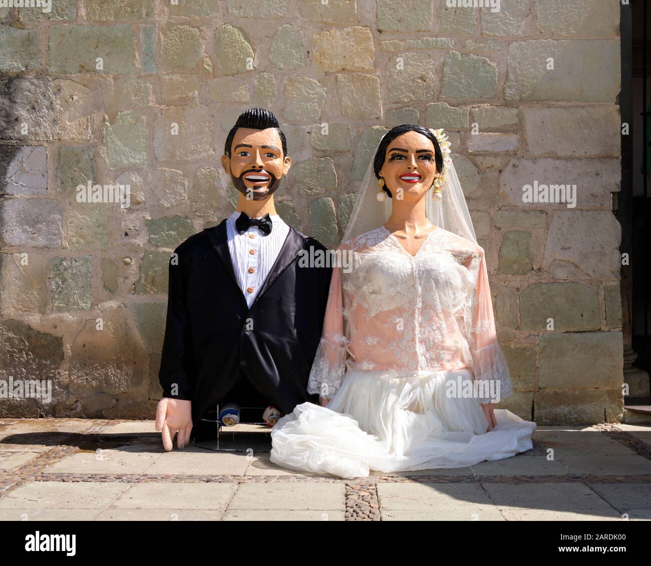 Giant puppets depicting the bride and groom prior to start of ...