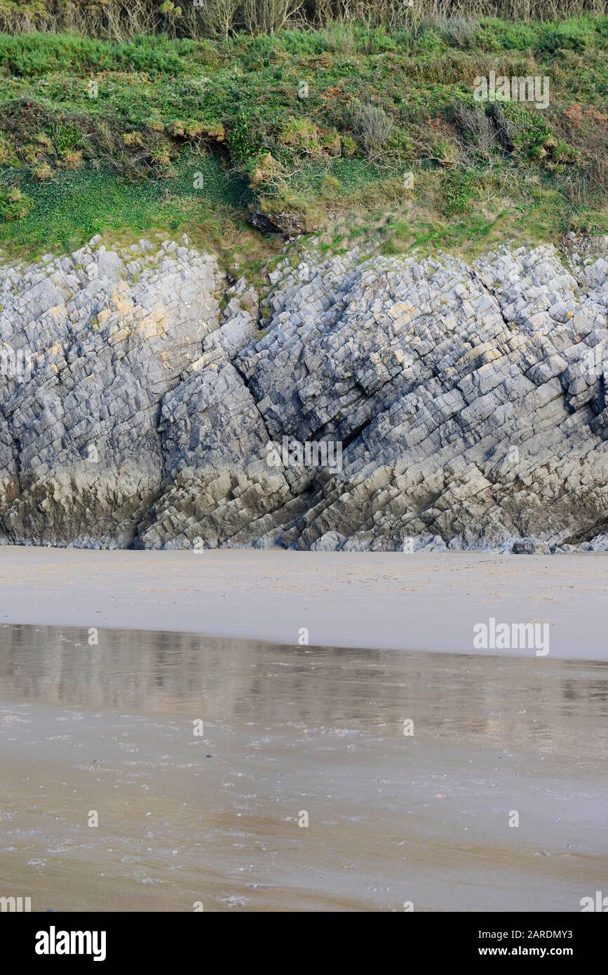 Carboniferous limestone rocks at Caswell Bay beach at Mumbles on the ...