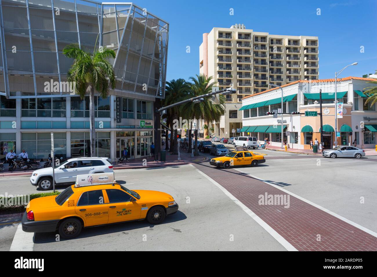 Elevated view of yellow cabs on 5th Street in South Beach, Miami ...