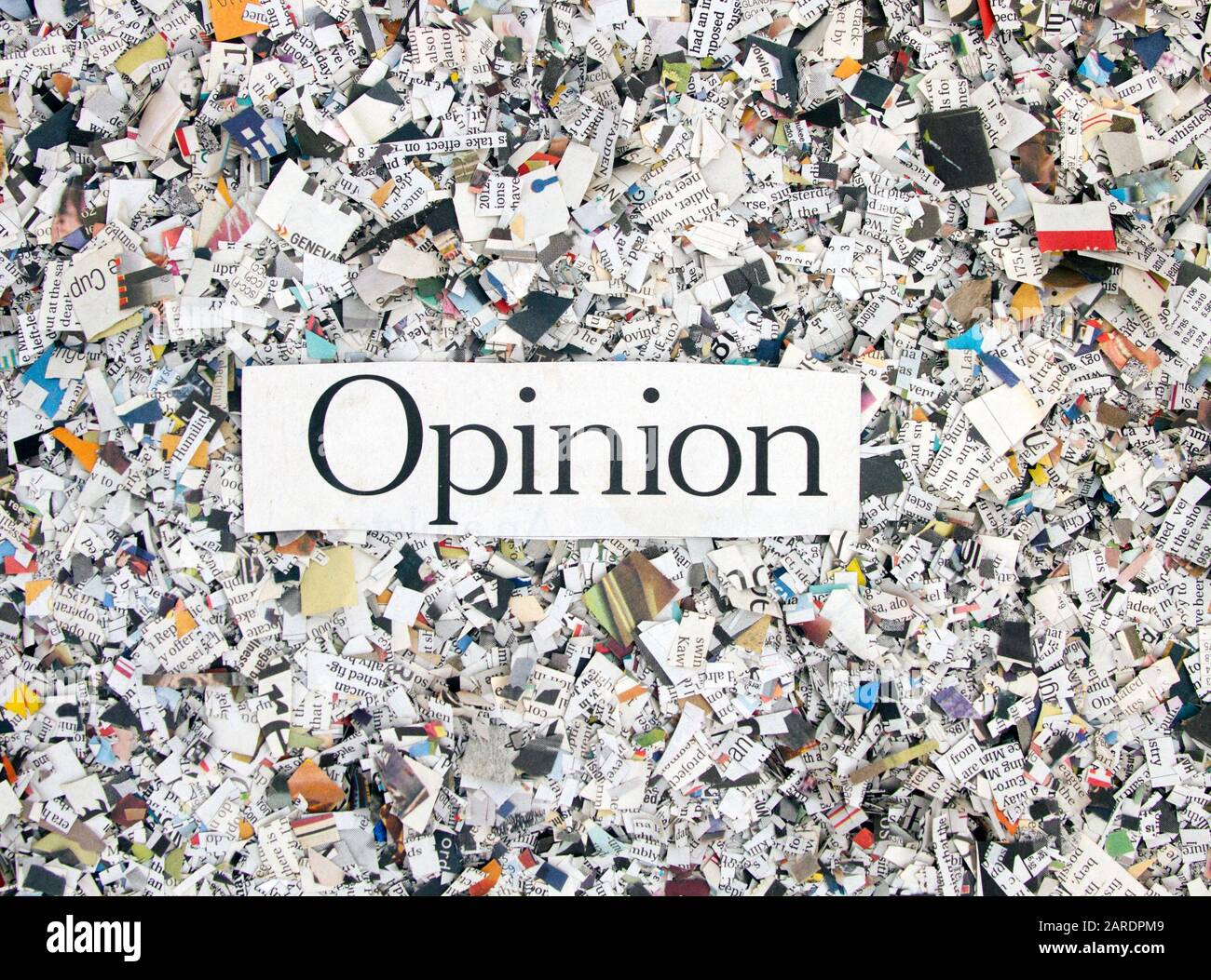 Newspaper confetti from above with the word Opinion background Stock ...