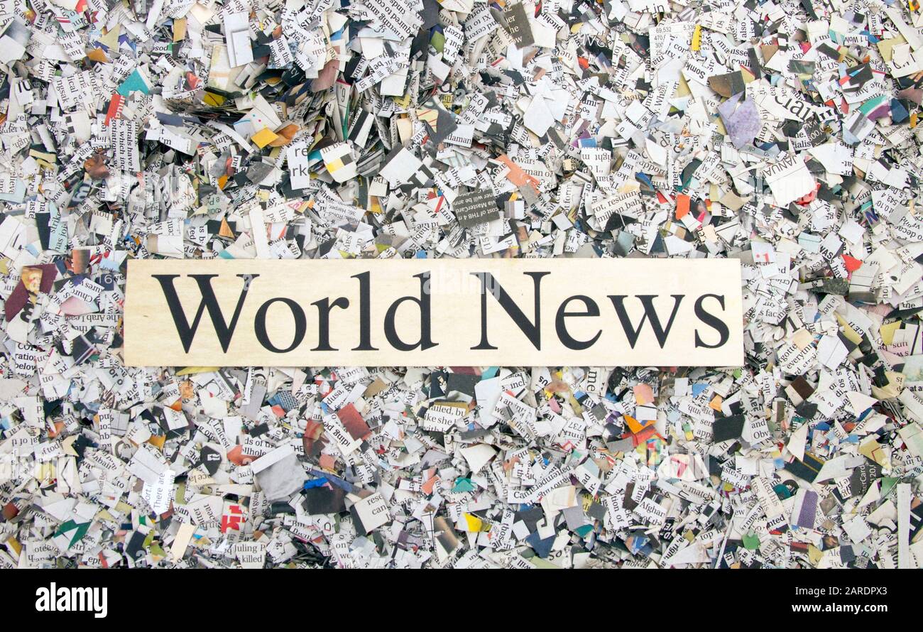 Newspaper confetti from above with the words World News background ...