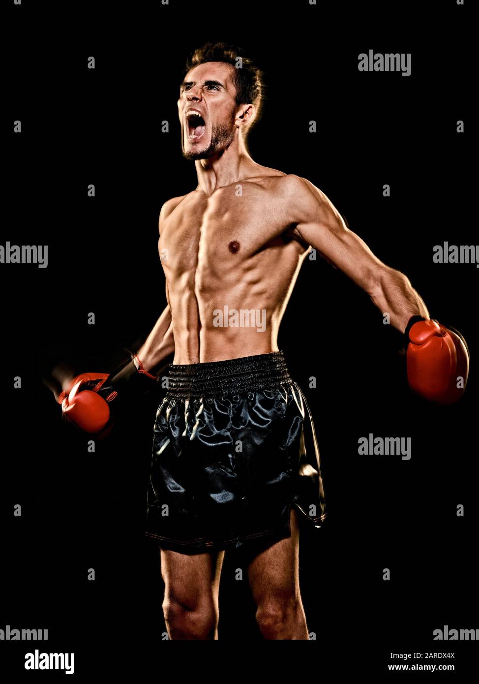 one caucasian young player man boxer boxing in studio isolated on black ...