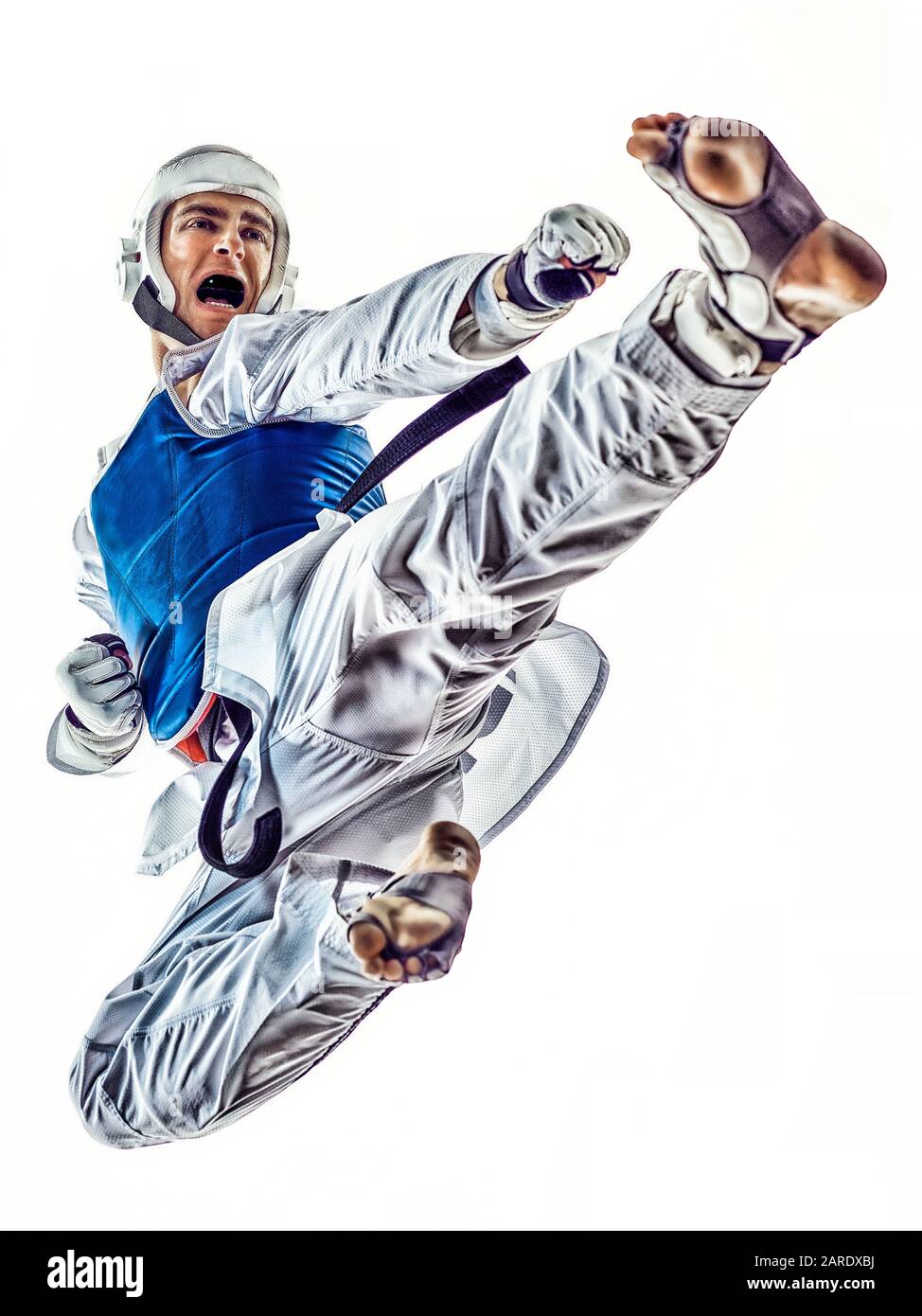 one caucasian man practicing Taekwondo in studio isolated on white ...