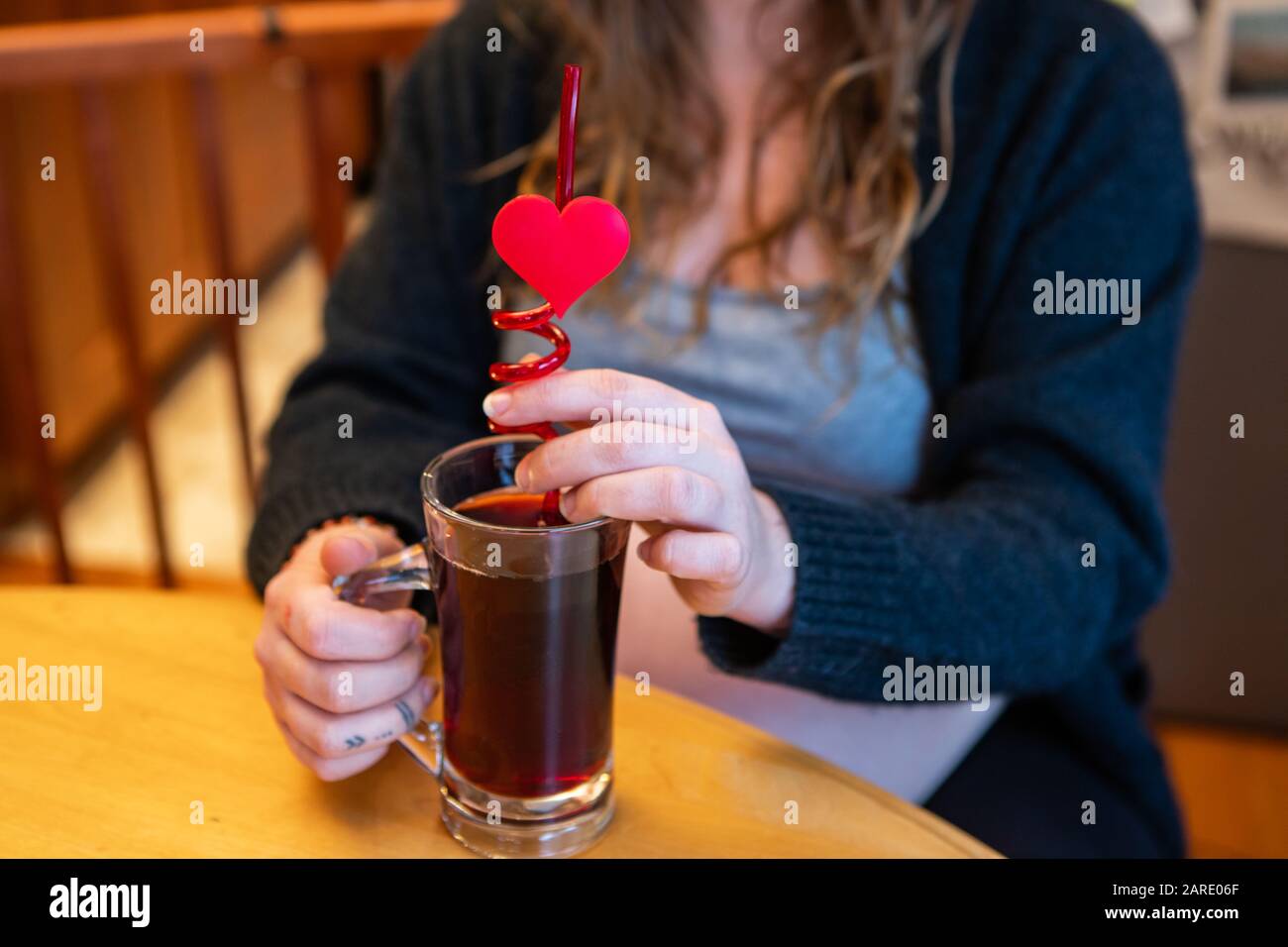 A close up view of a woman in later stages of pregnancy enjoying a ...