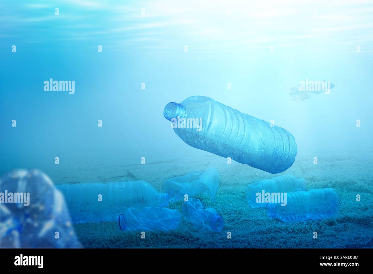 Underwater view with a plastic bottle on the ocean. Plastic pollution ...