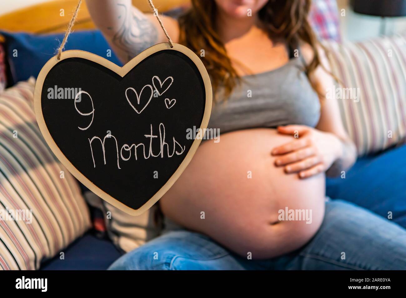 Third trimester, 9 months, labor and contractions concept as a heavily ...