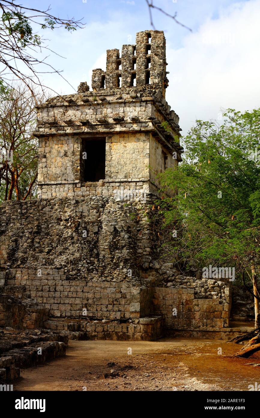 The ruins of the Structure V tower pierce a deep blue sky in the ...