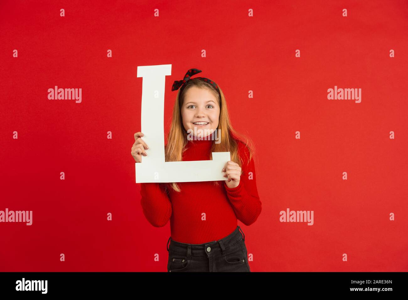 L - is Love. Valentine's day celebration, happy, cute caucasian girl ...