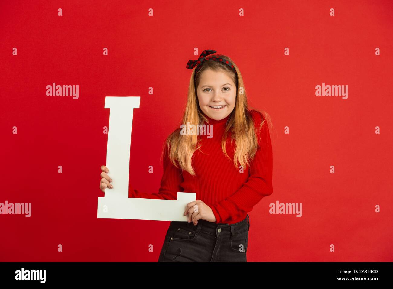 L - is Love. Valentine's day celebration, happy, cute caucasian girl ...