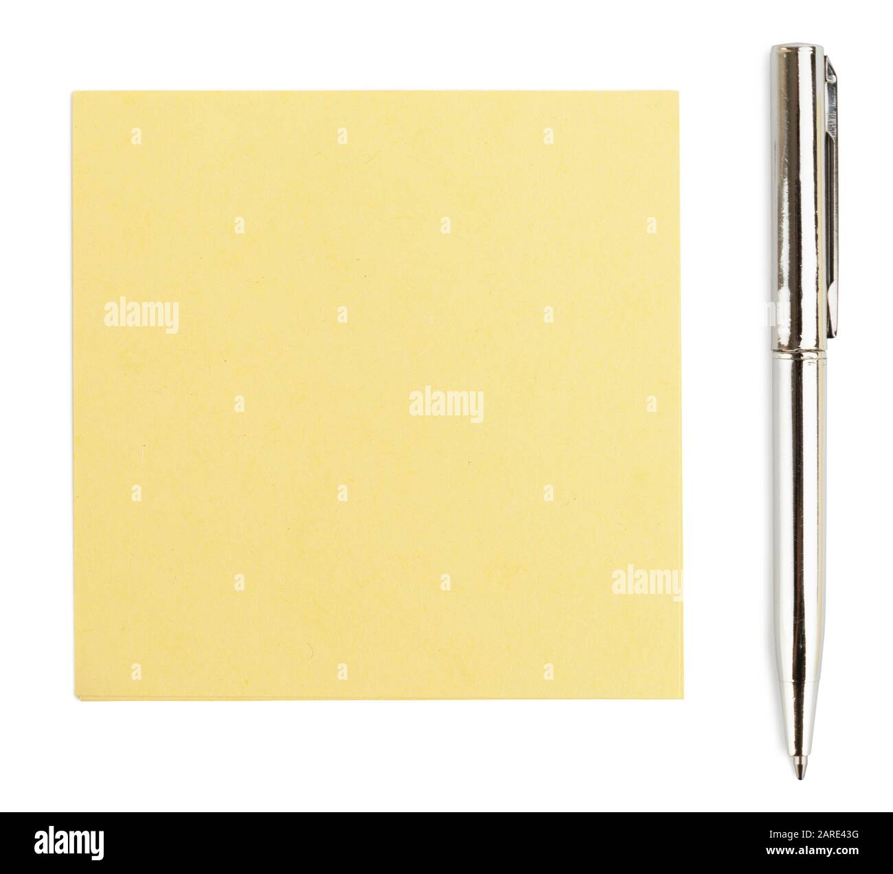 Blank yellow note paper and a pen isolated on white Stock Photo - Alamy