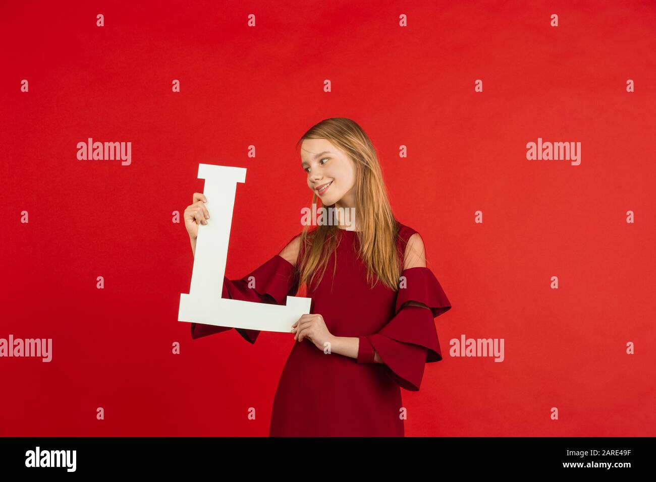 L - is Love. Valentine's day celebration, happy, cute caucasian girl ...