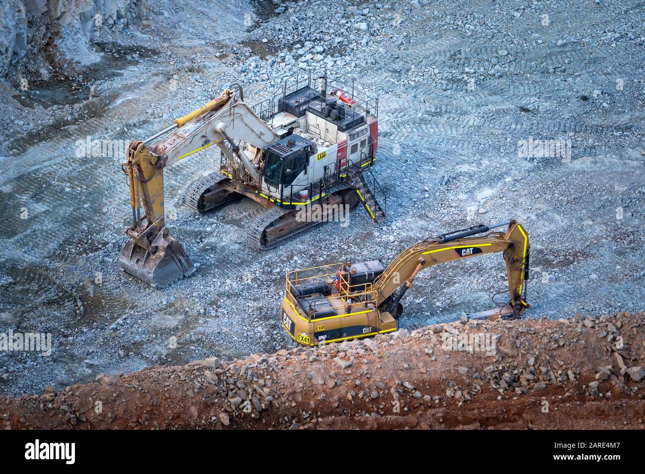 Heavy machinery on production floor of open pit gold mine Stock Photo ...