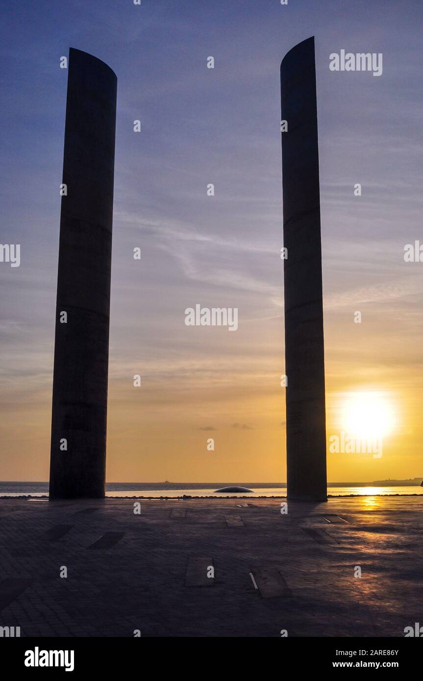 Vertical picture of the silhouettes of high-rise buildings during a ...