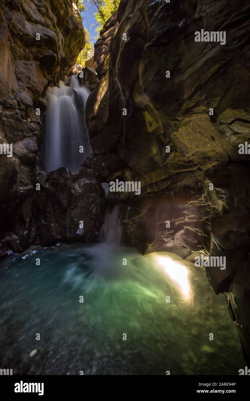 Vertical shot of water wall from the top of the cliff Stock Photo - Alamy