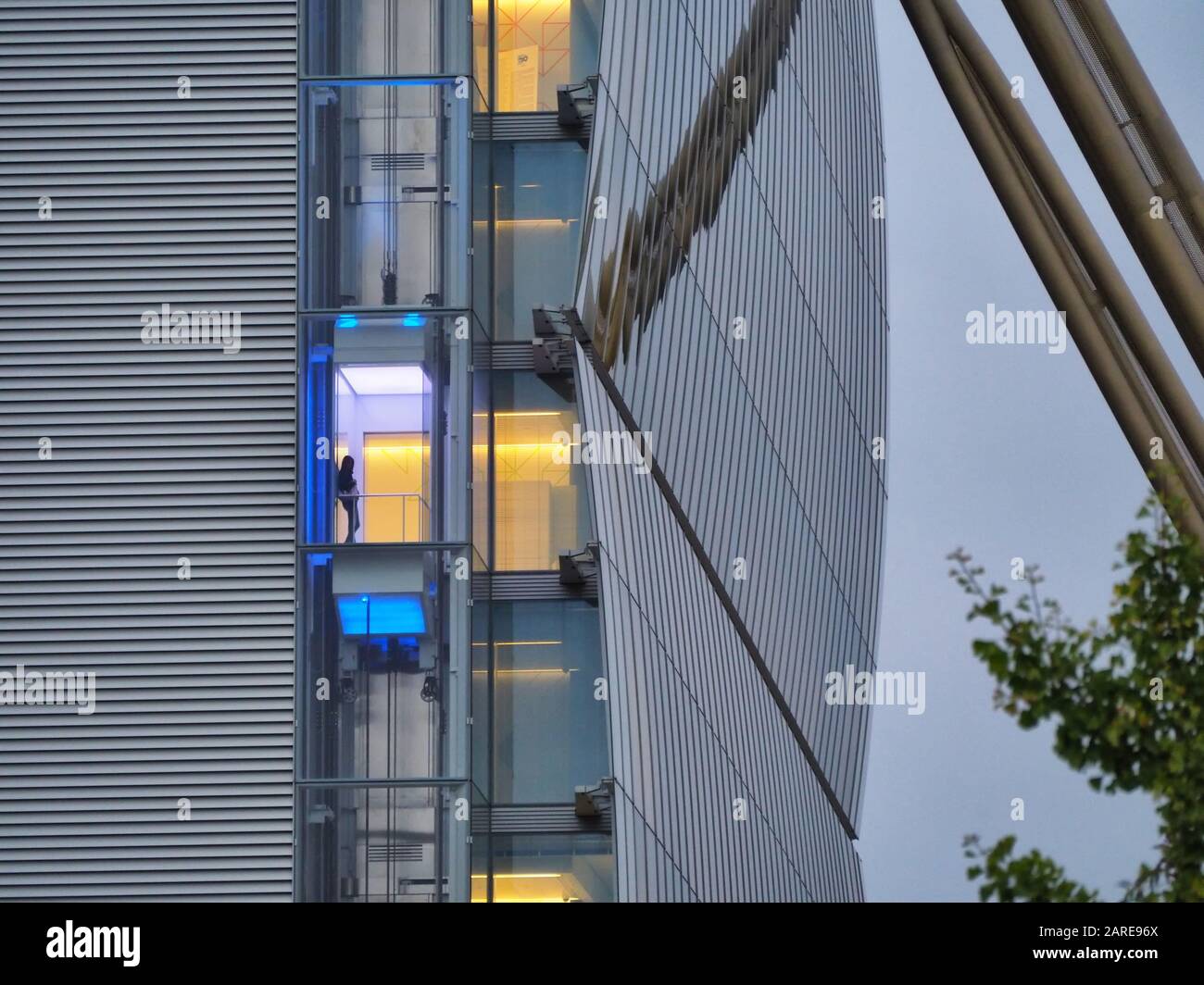 Moving outdoor glass elevator of a modern building Stock Photo - Alamy