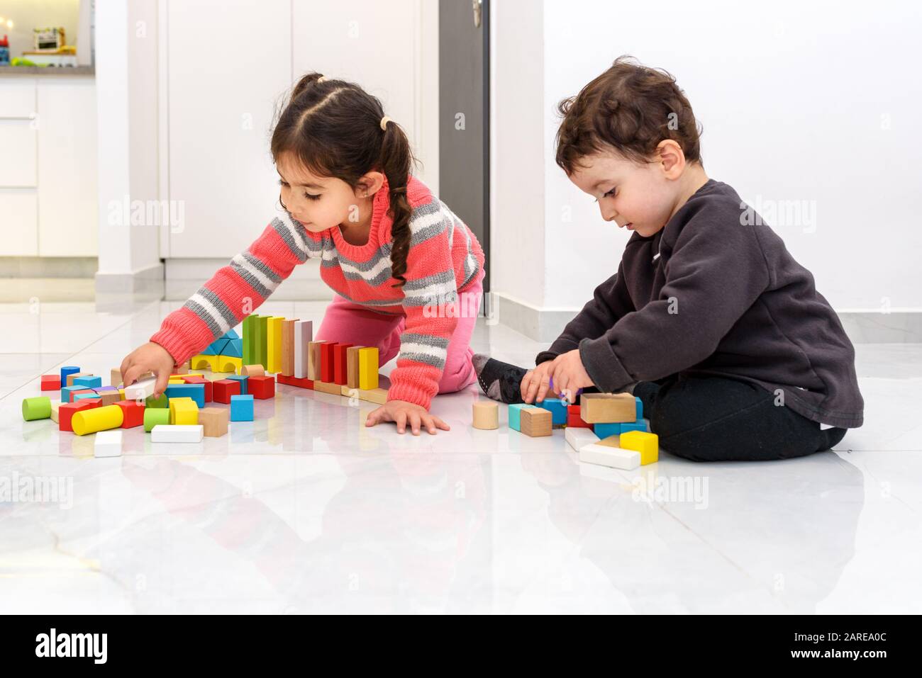 Happy children play with zero waste toys, different color and shape ...