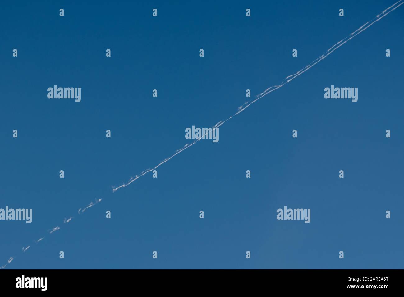 Plane track on the blue sky under the sunlight at daytime Stock Photo ...