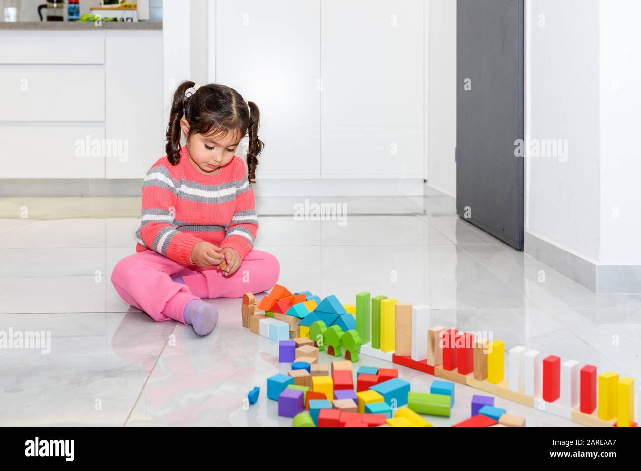 Cute toddler play with zero waste toys, different color and shape ...