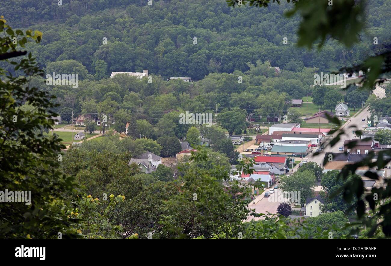 Overview of a town surrounded with green forest Stock Photo - Alamy