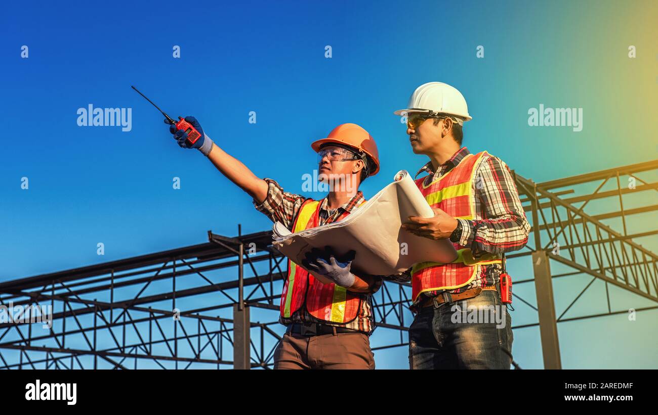 Engineers discussion with architects work planing in construction site ...