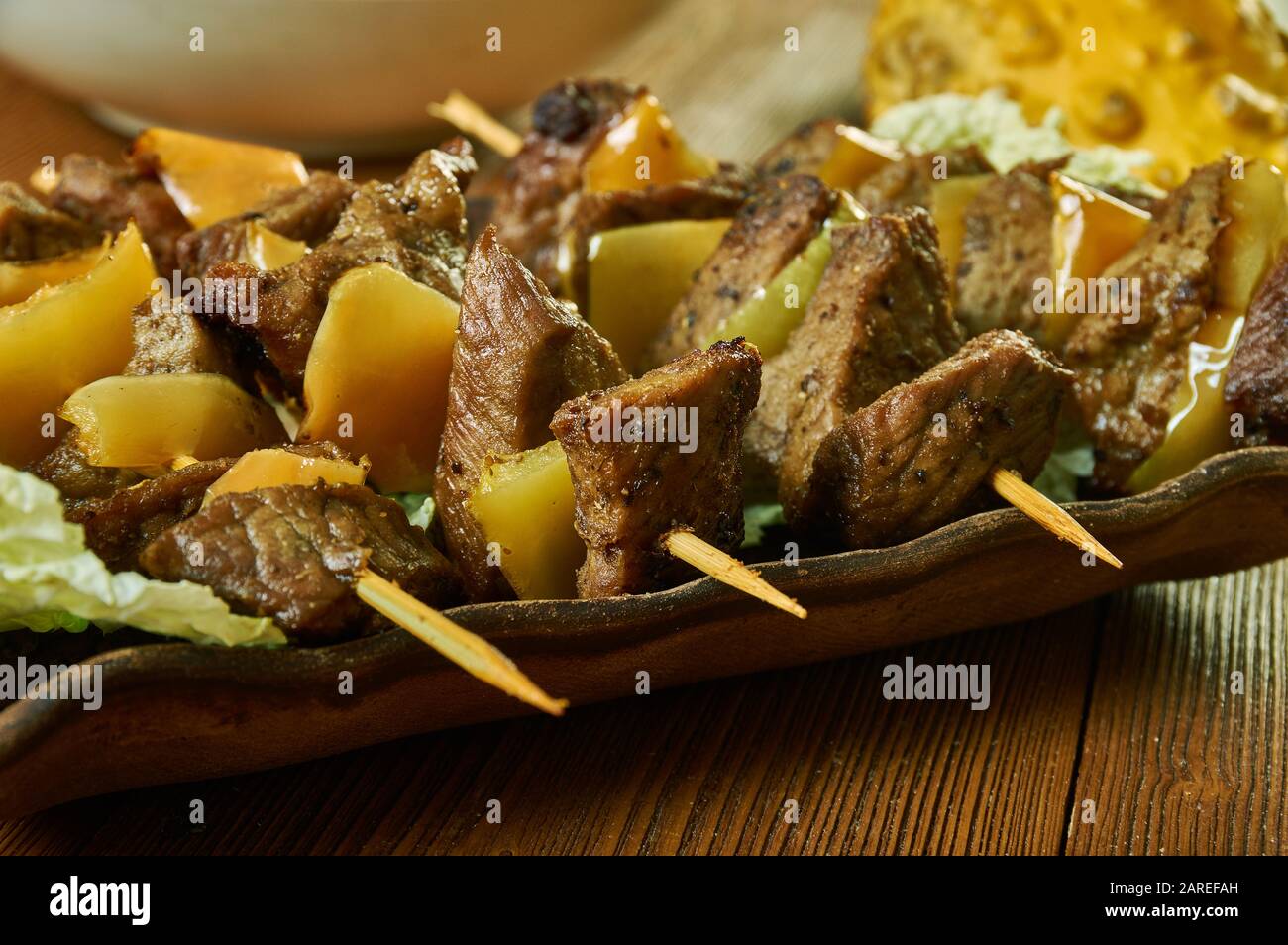Mshikaki, street food dish , skewered pieces of marinated meat such as ...