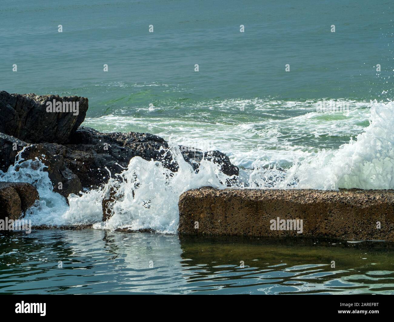 waves crashing over the wall into the natural wave pool Stock Photo - Alamy