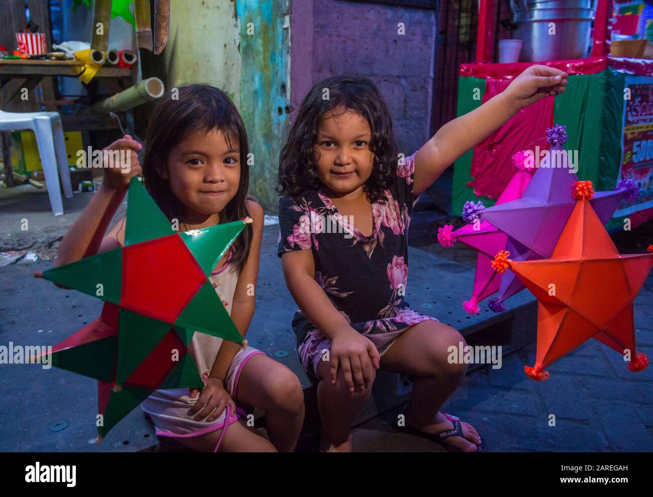 Filipino Girls Holding A Lantern In A Christmas Market In Las Pinas City Manila The