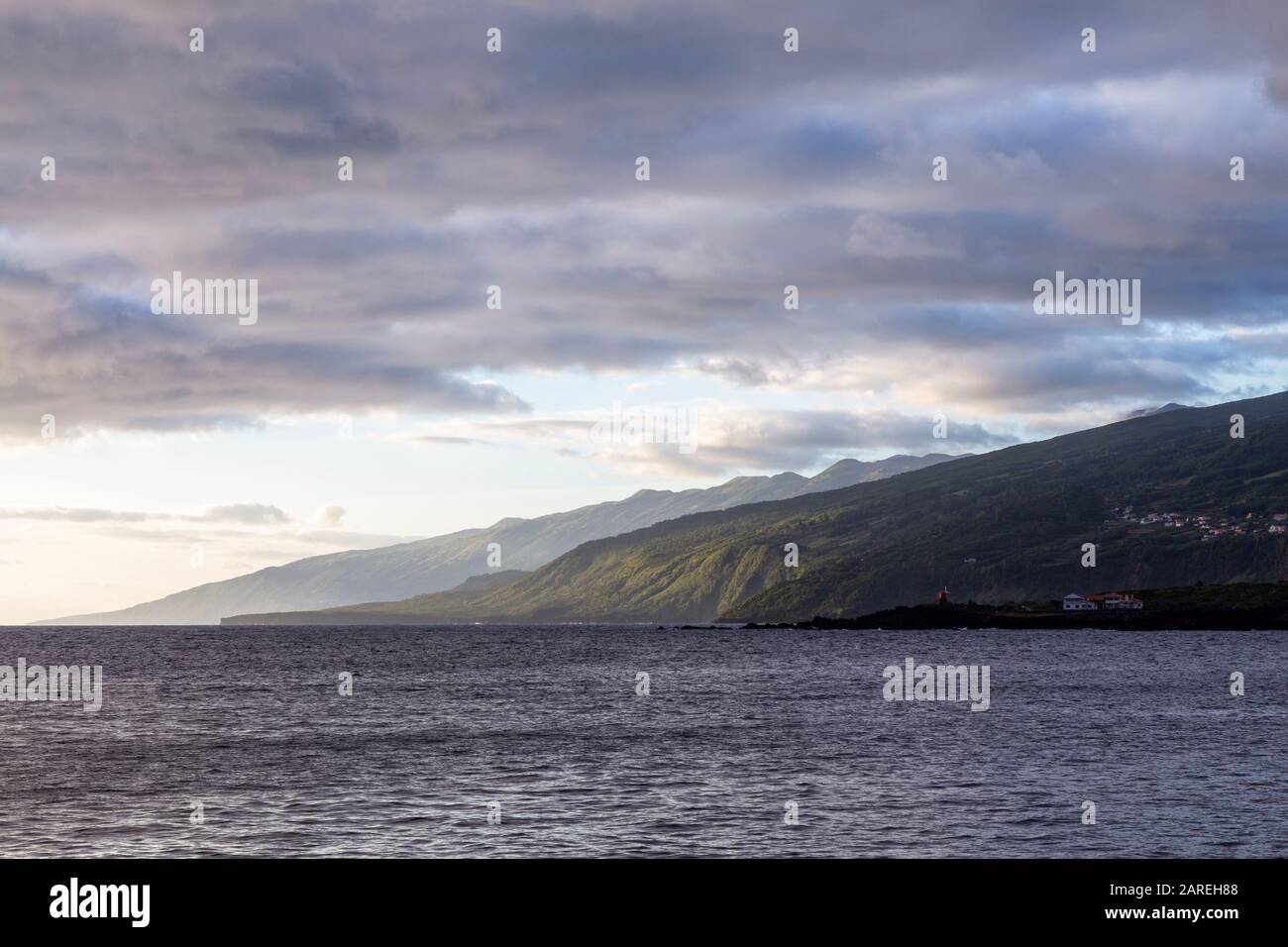 Beautiful sunrise light hits the northern edge of Pico island in the ...