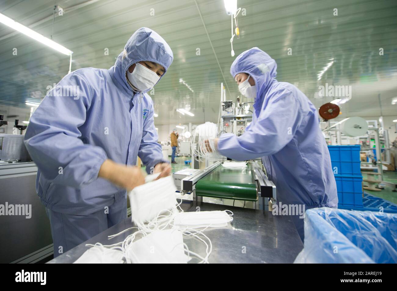 Chinese workers manufacture surgical face masks for prevention of the ...