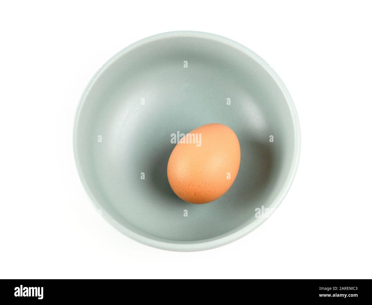 Put eggs in one bowl on white background Stock Photo - Alamy