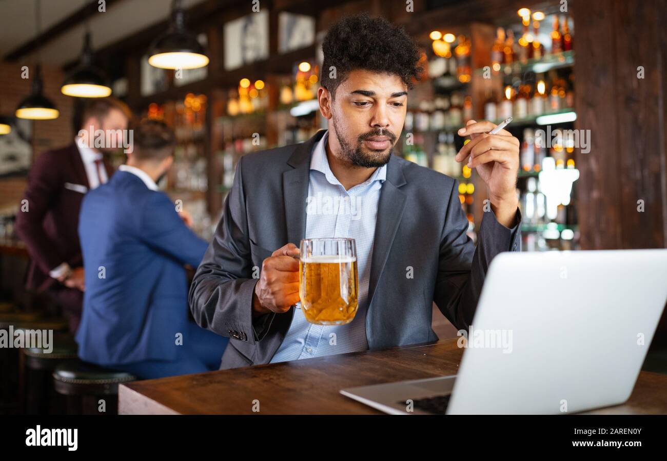 Man with cigarette at bar hi-res stock photography and images - Alamy