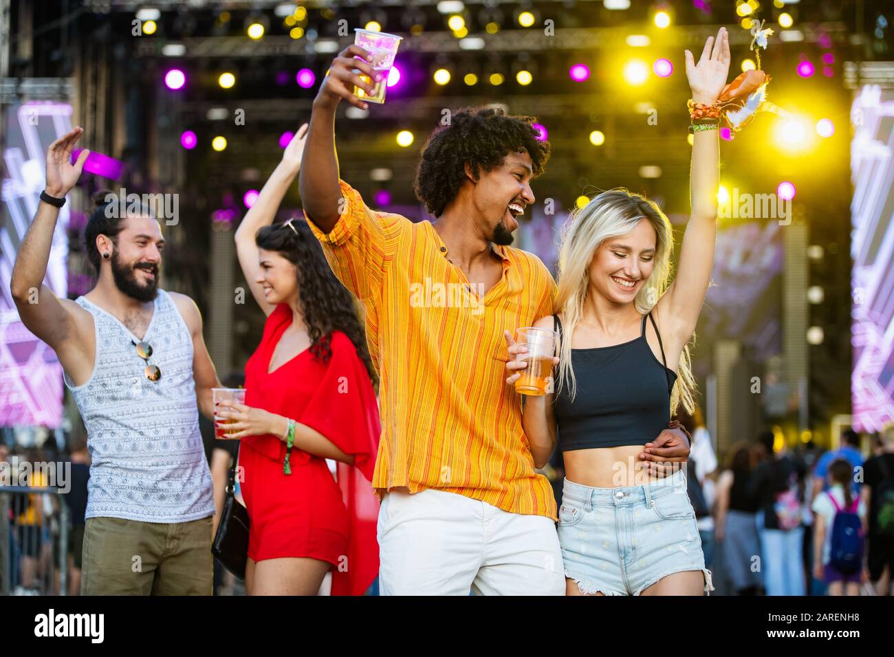 Group of friends having fun time at music festival Stock Photo - Alamy