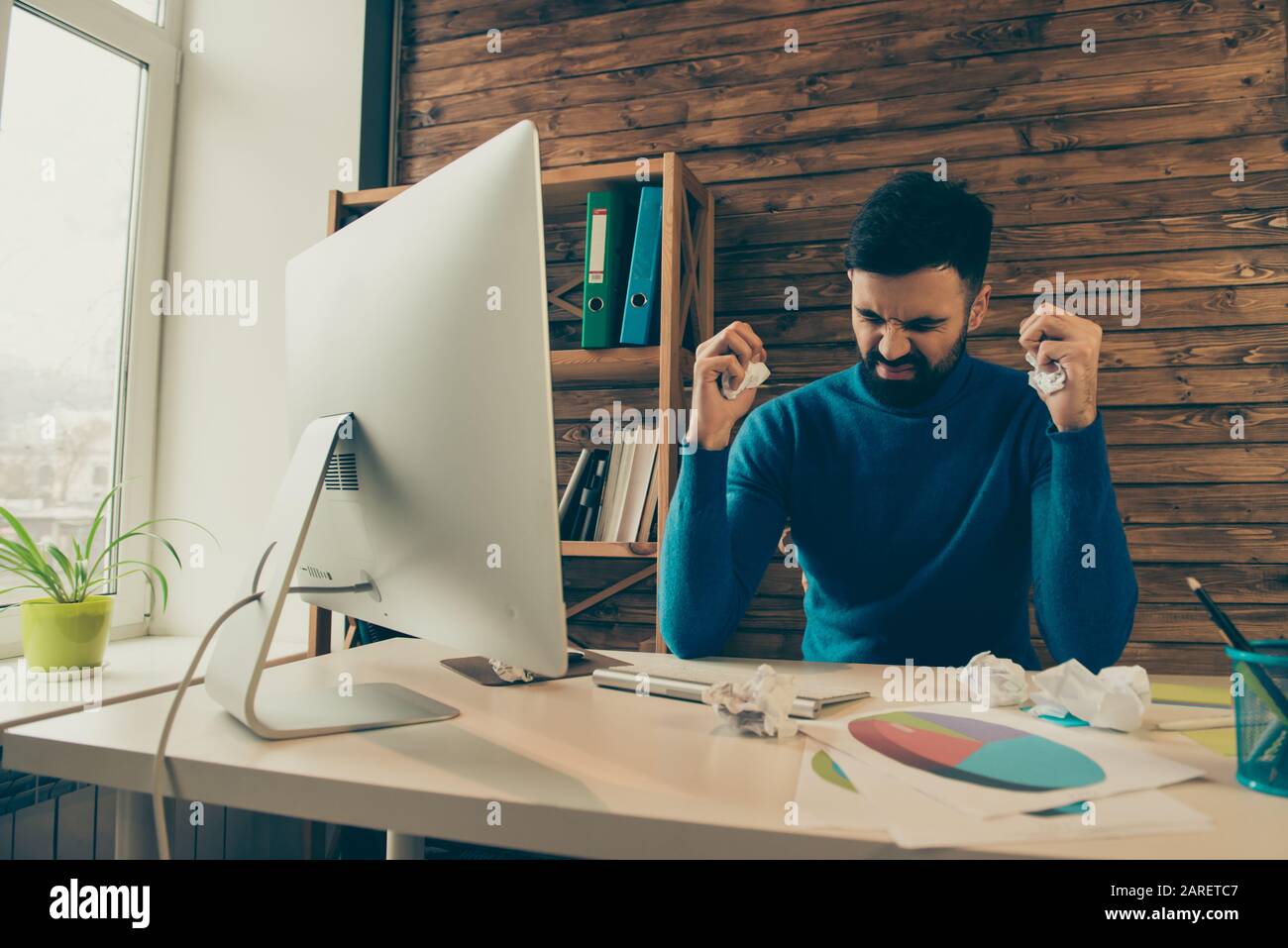 Overworked sad man yelling while working in office Stock Photo - Alamy