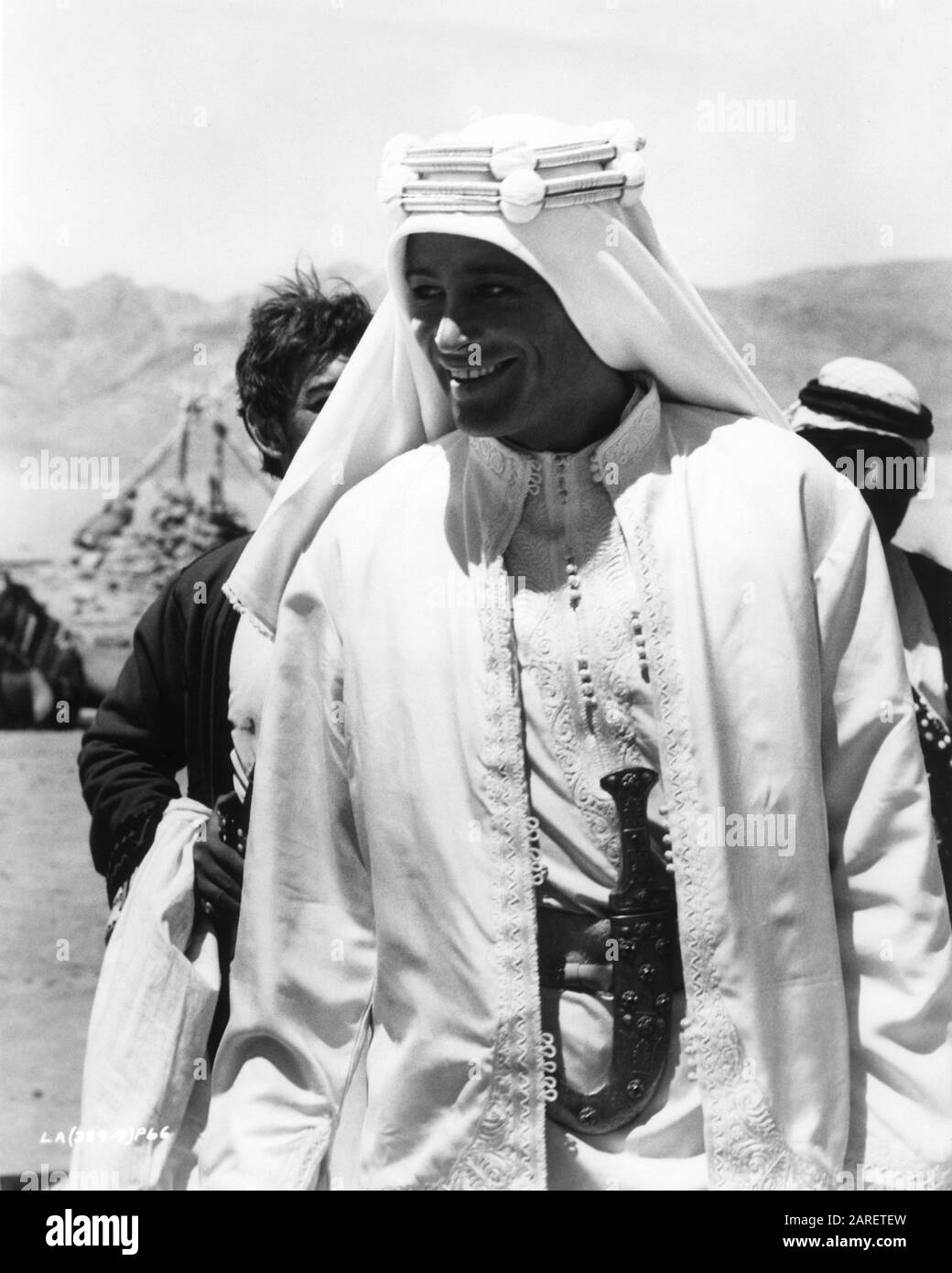 PETER O'TOOLE as T. E. Lawrence with JOHN DIMECH (behind at left) on ...