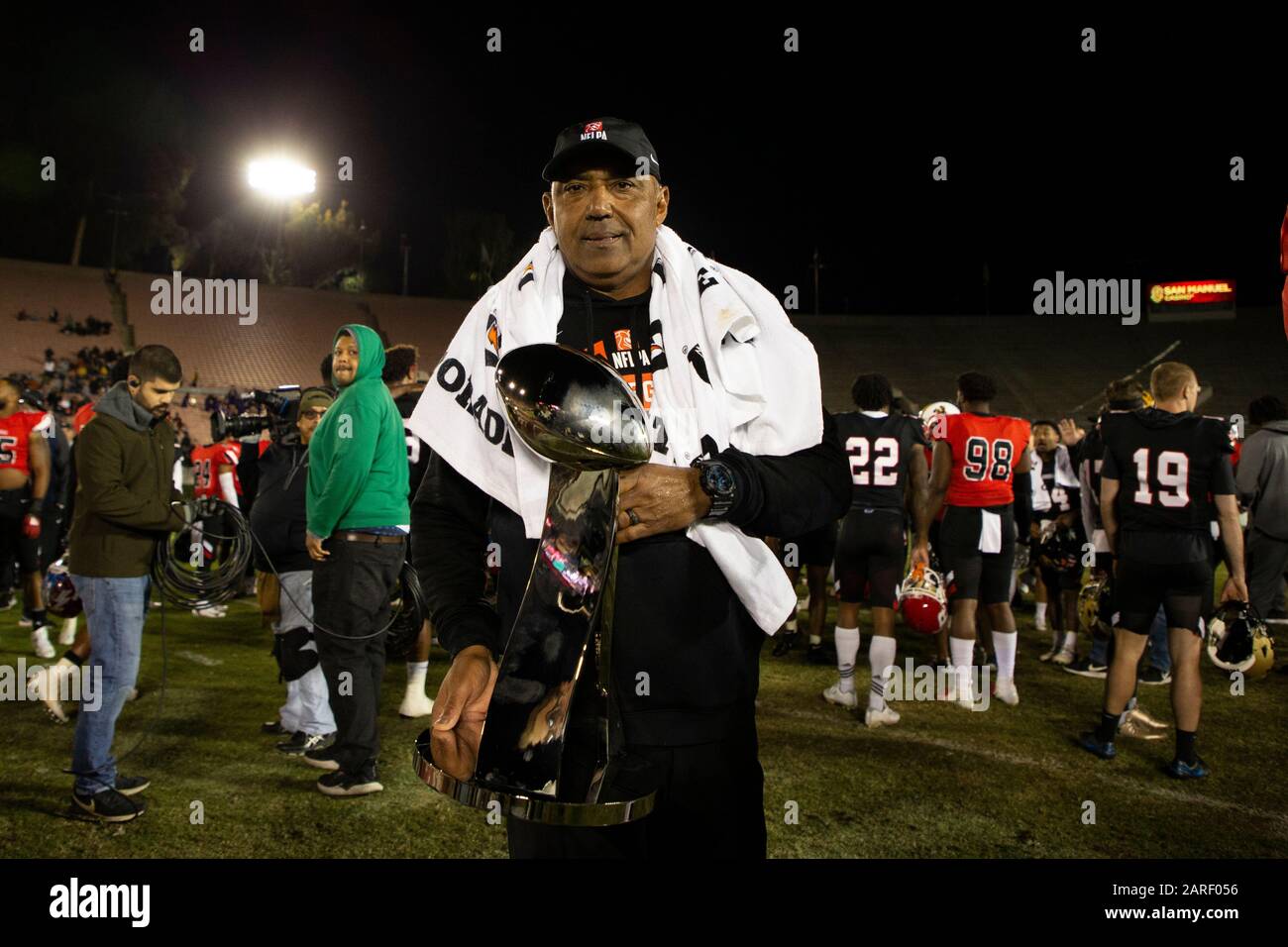 National Team head coach Marvin Lewis with the Collegiate Bowl trophy ...