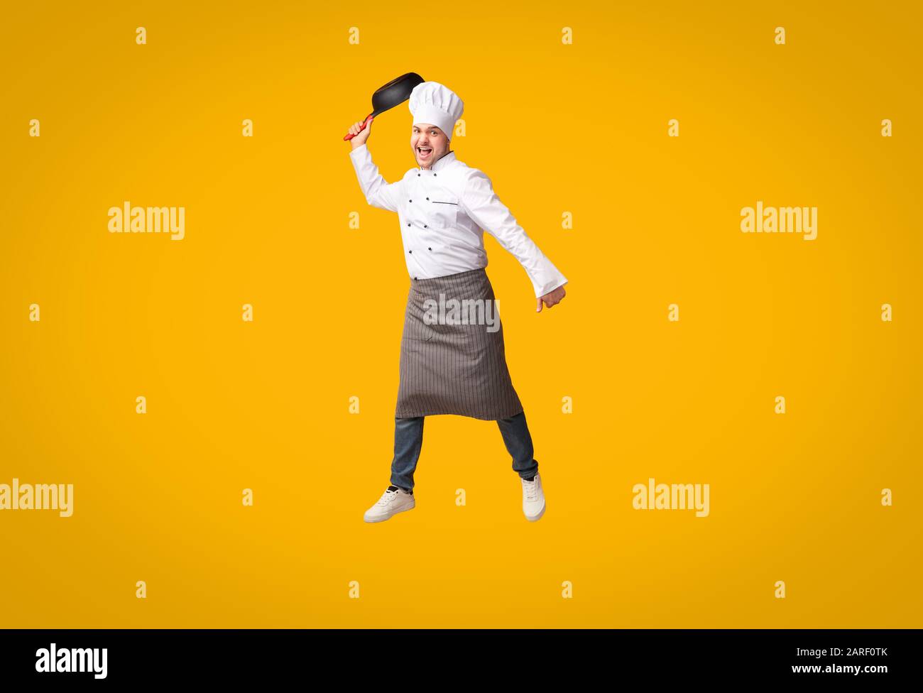 Funny Chef Man Jumping Raising Frying Pan, Yellow Background Stock ...
