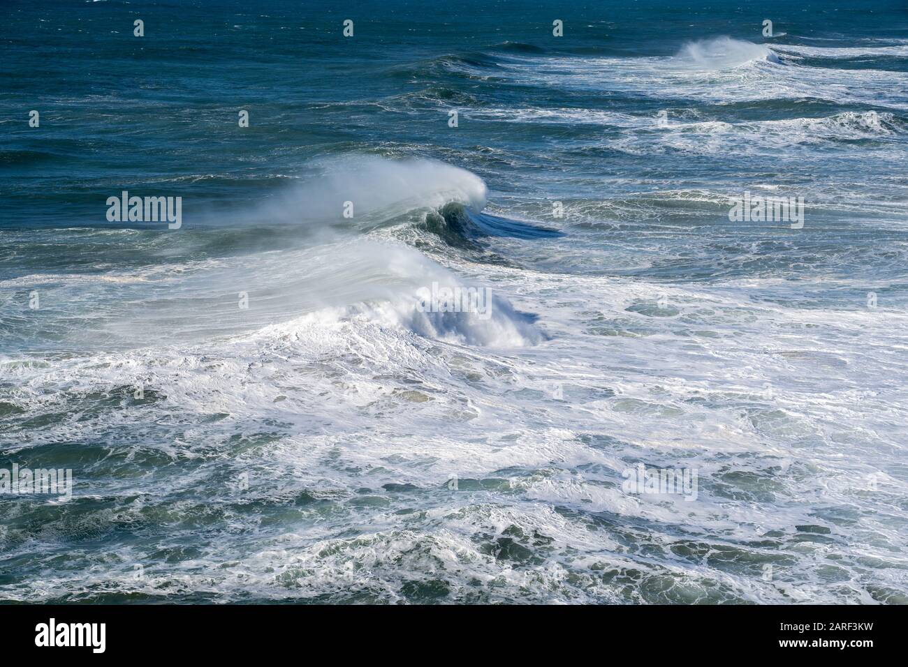 Large surf waves breaking near the beach in Praia do Norte in Nazare ...
