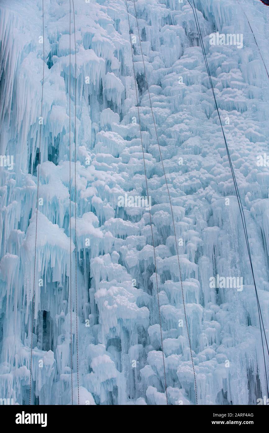 Track for winter climbing. Ice wall with safety ropes Stock Photo - Alamy