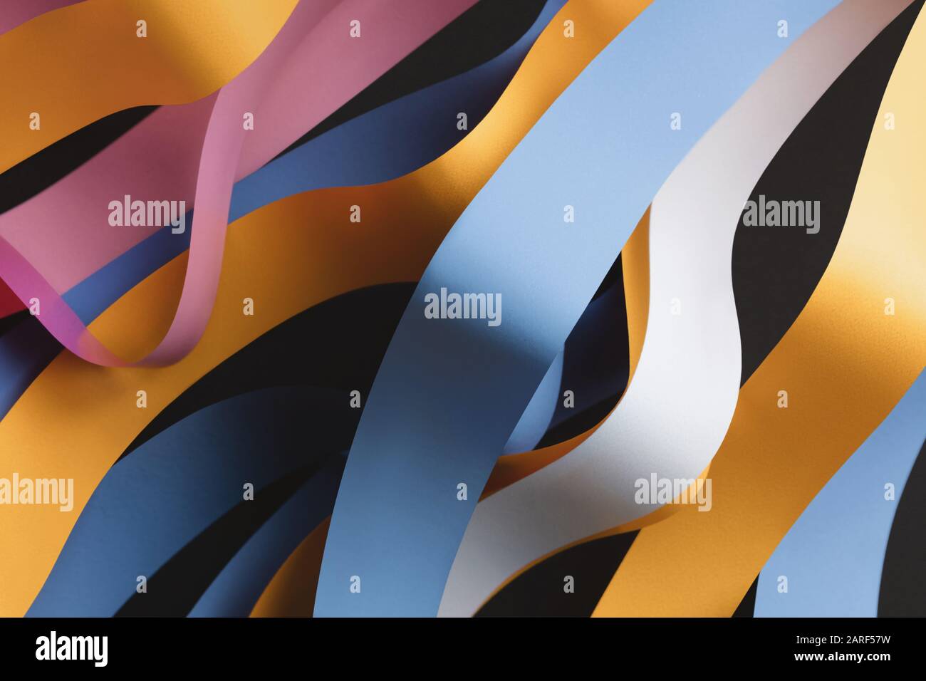 Colorful ribbons on black background; abstract Stock Photo - Alamy