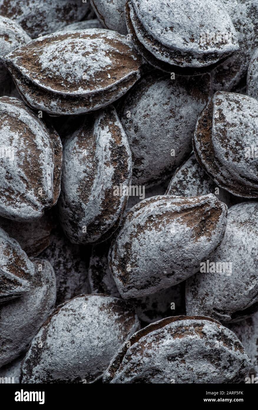 Food and drinks: large group of unpeeled roasted apricot kernels ...