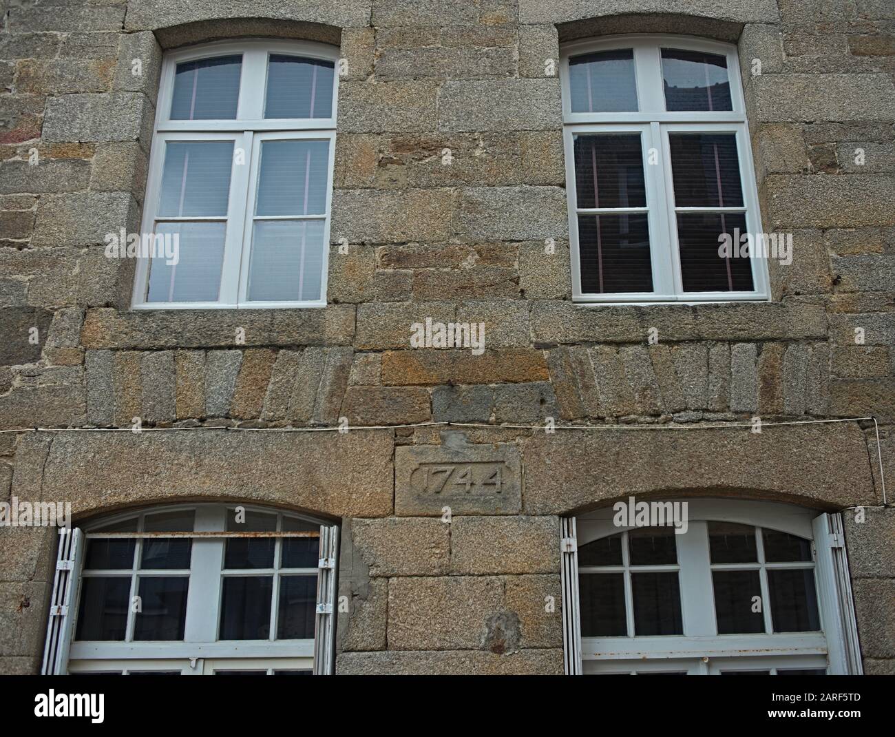 Traditional french stone building with many windows Stock Photo - Alamy