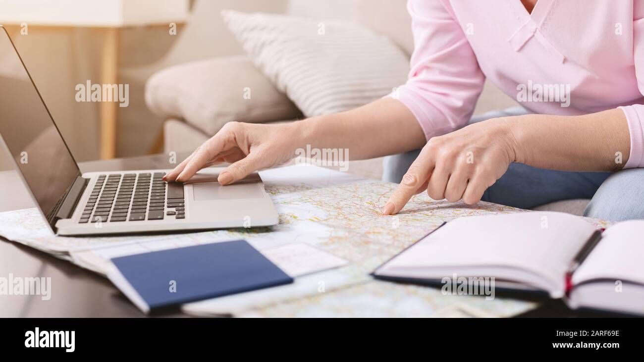 Senior lady browsing on laptop about destination sights Stock Photo - Alamy