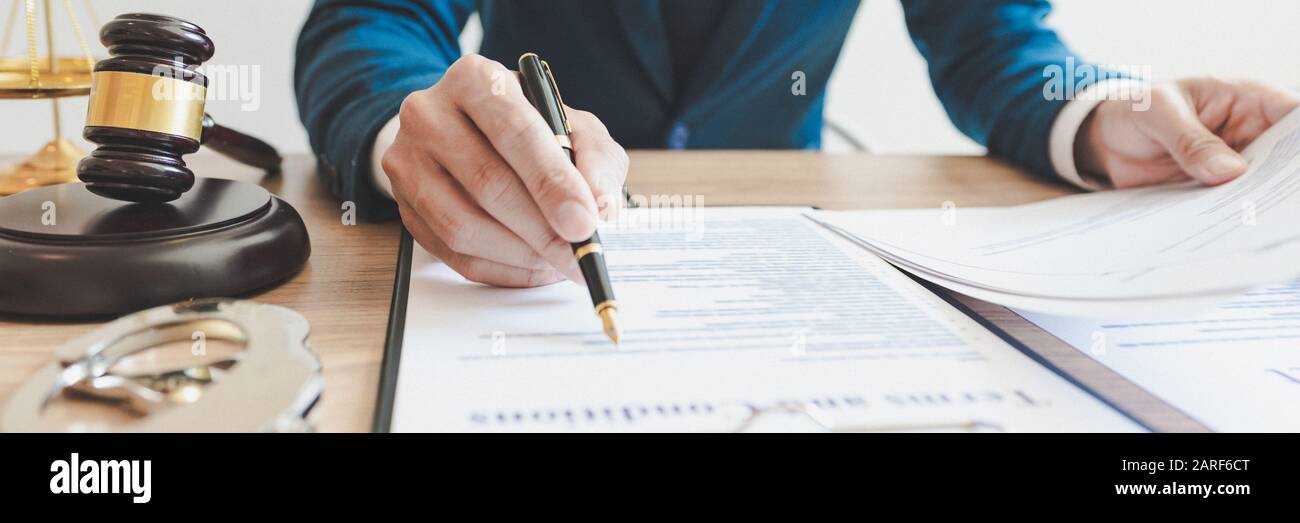 lawyer judge reading documents at desk in courtroom Stock Photo - Alamy